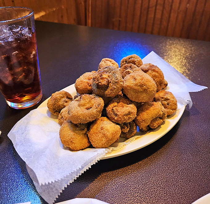 These breaded mushrooms aren't just appetizers; they're little golden orbs of happiness that could make even a mushroom skeptic reconsider their life choices.