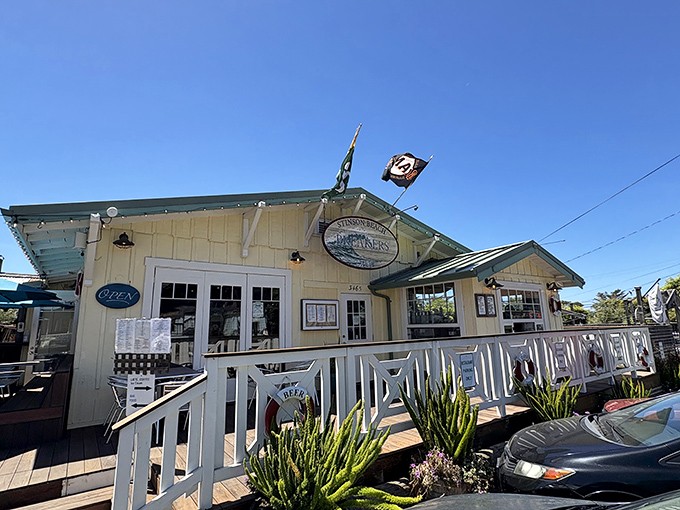 Breakers Caf&eacute; stands like a cheerful sentinel of sustenance, its weathered charm promising comfort food with a side of salt air.