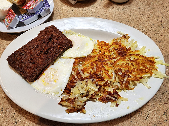 Sunny-side up eggs with perfectly crisped hash browns—the breakfast equivalent of hitting all green lights on your morning commute.
