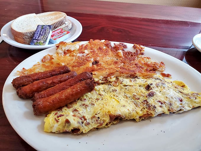 Breakfast nirvana: A perfectly executed omelet with crispy hash browns and sausage links that snap with each bite. Morning glory, indeed!