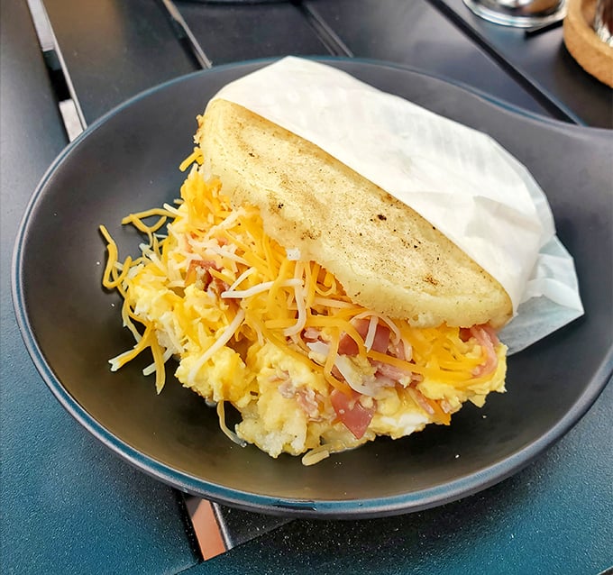 This breakfast arepa is what would happen if a perfect omelet and a cornmeal cake fell in love and had a beautiful, cheese-oozing baby.