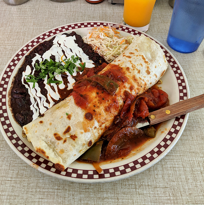 Behold the breakfast burrito in its natural habitat&mdash;a tortilla-wrapped masterpiece flanked by black beans and slaw that makes morning meetings worth canceling.