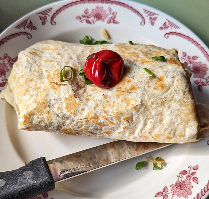 Behold the legendary breakfast burrito in all its glory! That perfectly toasted exterior hides a treasure trove of morning delights within.