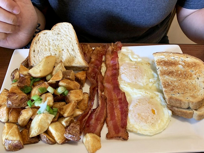 Breakfast perfection on a plate &ndash; those home fries are the supporting actors that steal the show from the eggs and bacon.