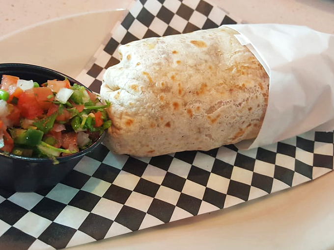 This breakfast burrito isn't just wrapped in a tortilla &ndash; it's wrapped in culinary glory. Fresh salsa stands by, ready for its supporting role in your morning masterpiece.