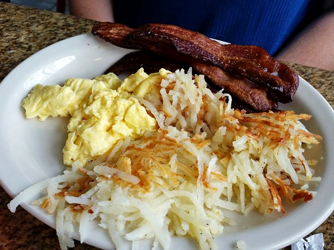 Breakfast nirvana: fluffy scrambled eggs, crispy hash browns, and bacon that's achieved that perfect balance between chewy and crisp. The breakfast trifecta!