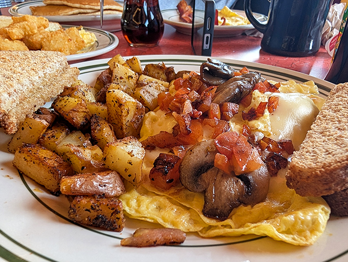 This isn't just an omelet&mdash;it's a masterpiece of morning indulgence, with perfectly seasoned potatoes that would make any hash brown aficionado weep with joy.