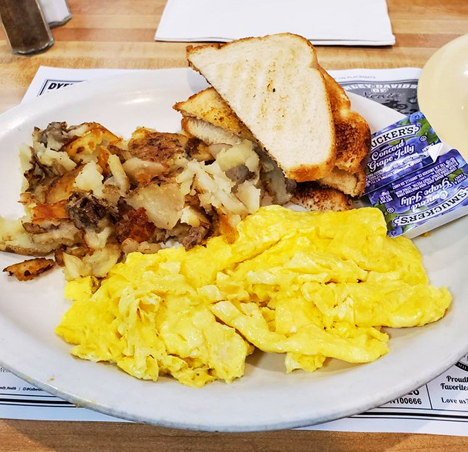 Breakfast perfection isn't complicated: golden scrambled eggs, crispy home fries, and toast that's actually toasted properly. Revolutionary concept!