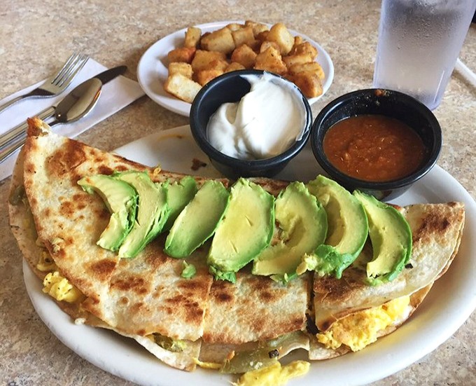 This breakfast quesadilla arrives dressed to impress with California's finest green gold fanned across the top.
