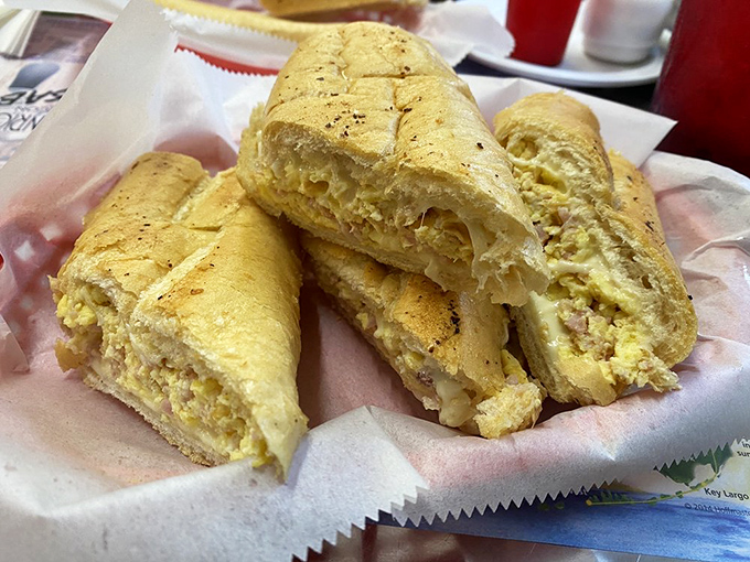 Behold the breakfast sandwich in all its glory! Layers of egg, ham, and cheese nestled between Cuban bread that's been kissed by the sandwich press gods.
