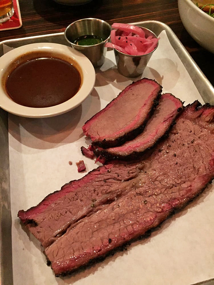 Brisket so perfectly smoked it should have its own Instagram account. That pink smoke ring isn't just photogenic &ndash; it's the barbecue equivalent of a Michelin star.