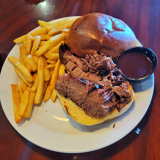 This brisket sandwich isn't just a meal, it's a religious experience with fries. The smoke ring alone deserves its own Instagram account.