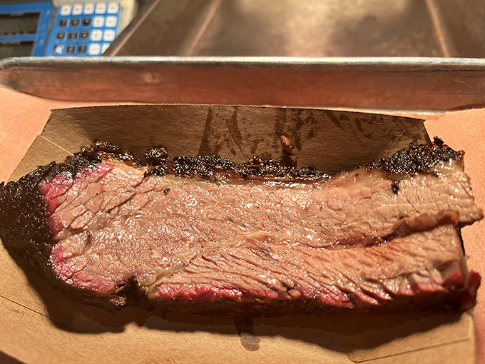 Brisket so perfectly smoked it should have its own Instagram account. That pink smoke ring is the barbecue equivalent of a Michelin star.