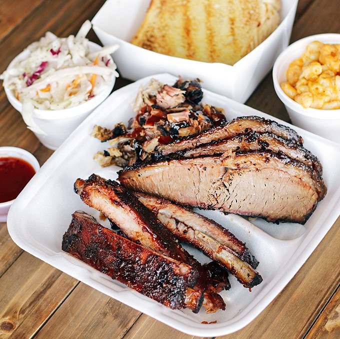 Behold the brisket plate&mdash;where smoke ring meets bark in perfect harmony. Those sides aren't afterthoughts; they're worthy companions to the star.