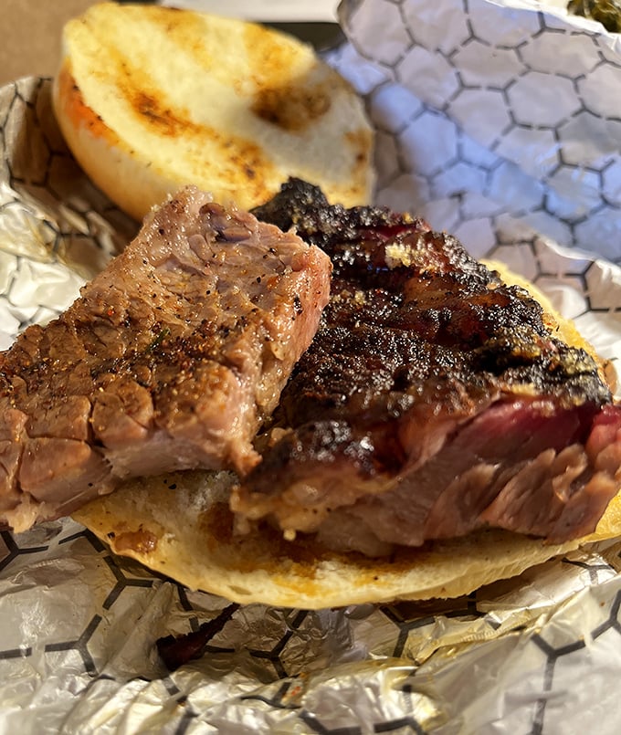 This isn't just a brisket sandwich &ndash; it's a masterclass in smoke and patience, with that perfect pink ring that makes barbecue aficionados weak in the knees.