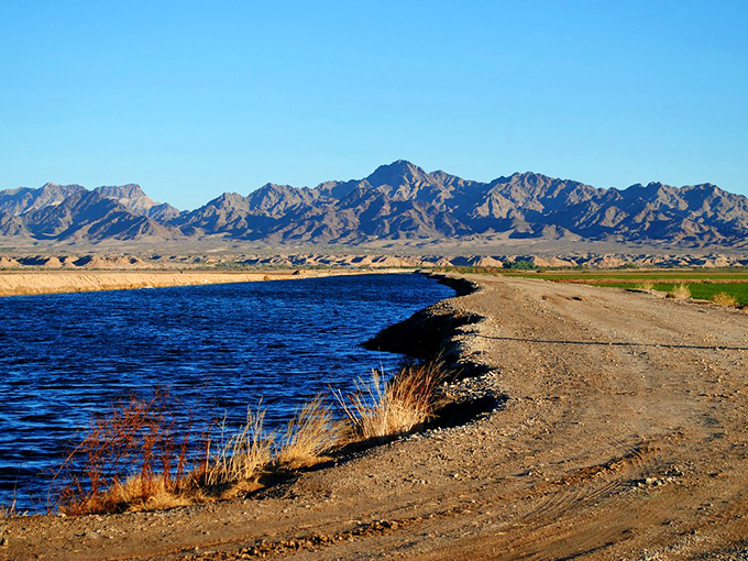 The Colorado River carves a life-giving blue ribbon through the arid landscape, a liquid miracle that makes Blythe's existence possible.