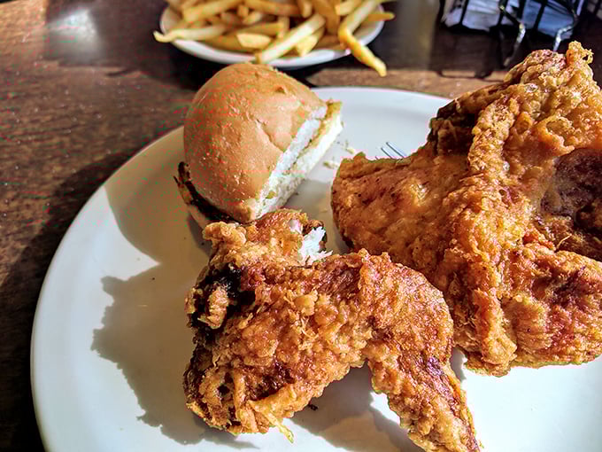 Golden-brown perfection that makes you understand why people drive for miles &ndash; broasted chicken that's crispy outside, juicy inside.