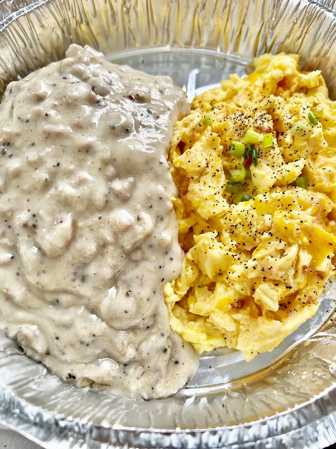 Breakfast nirvana: fluffy scrambled eggs meet their soulmate in creamy sausage gravy. The kind of plate that makes you forget your table manners.