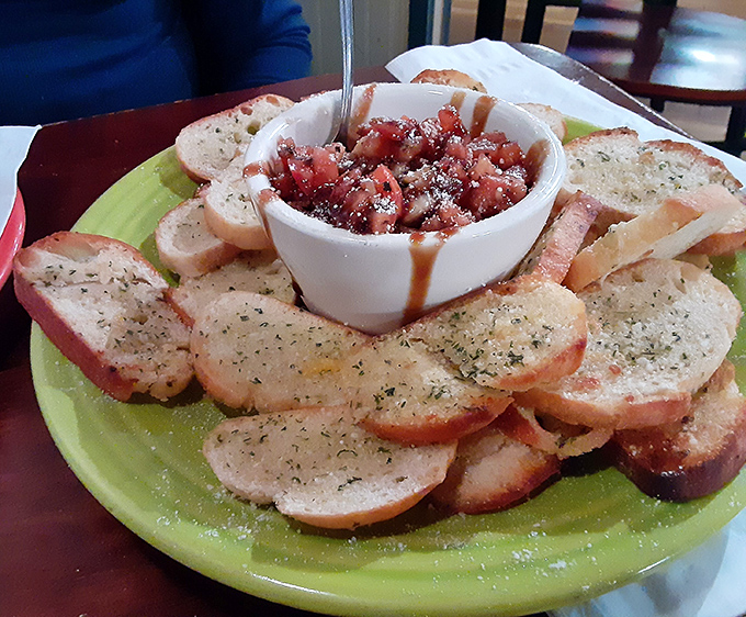 Behold the bruschetta that launched a thousand road trips &ndash; fresh tomatoes dancing on perfectly toasted bread.