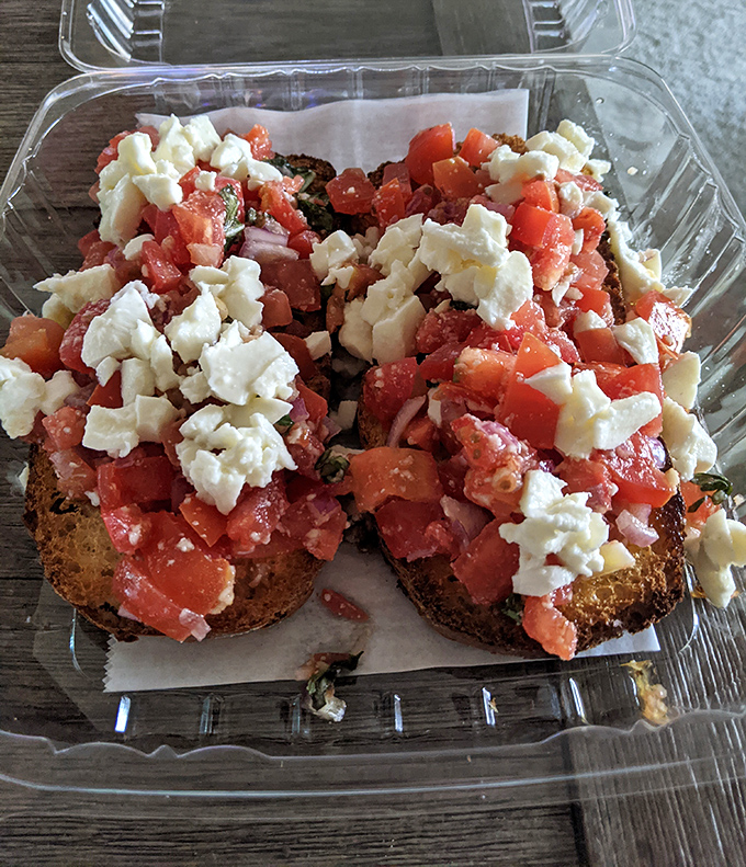 Behold the bruschetta that launched a thousand return trips&mdash;crispy bread, fresh tomatoes, and crumbled cheese in perfect harmony.