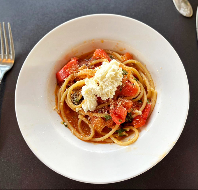 The bucatini that launched a thousand road trips&mdash;perfectly al dente pasta with fresh tomatoes and a crown of ricotta that melts into saucy perfection.