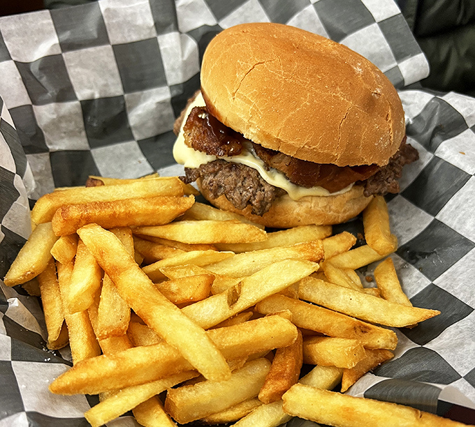 The burger that launched a thousand return trips. Golden fries standing at attention beside a patty that remembers when beef tasted like beef.