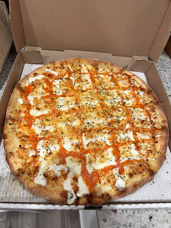 This golden-crusted masterpiece showcases Dino's perfect balance of sauce, cheese, and toppings &ndash; proof that pizza perfection doesn't need fancy ingredients, just proper execution.