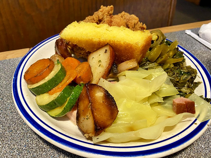 A plate that tells the story of buffet strategy&mdash;a little of this, a touch of that, and somehow cornbread always makes the final cut.