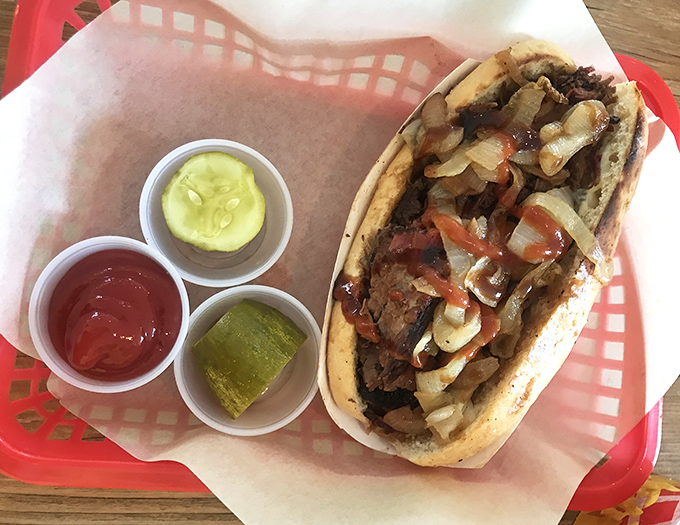 Not just a sandwich but an architectural marvel of meat. The Bully comes with its own support system of pickles and condiments, like backup dancers for the star.