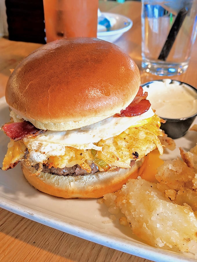 The Breakfast Burger&mdash;where morning meets midday in a symphony of runny egg, crispy bacon, and beef. Your diet plan's arch-nemesis has never looked so glorious.