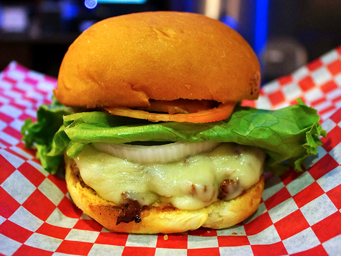 This isn't just a burger&mdash;it's edible architecture. Melted cheese cascades over perfectly seared beef like a dairy waterfall.