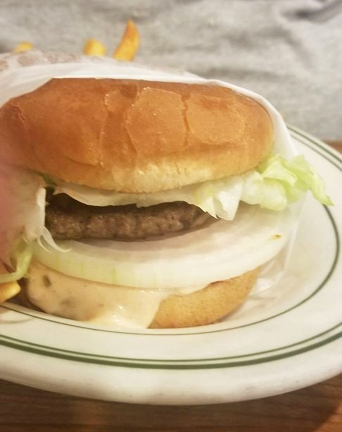 Behold, burger perfection in its purest form&mdash;no pretentious toppings or artisanal nonsense, just the harmonious marriage of beef, cheese, and fresh vegetables.