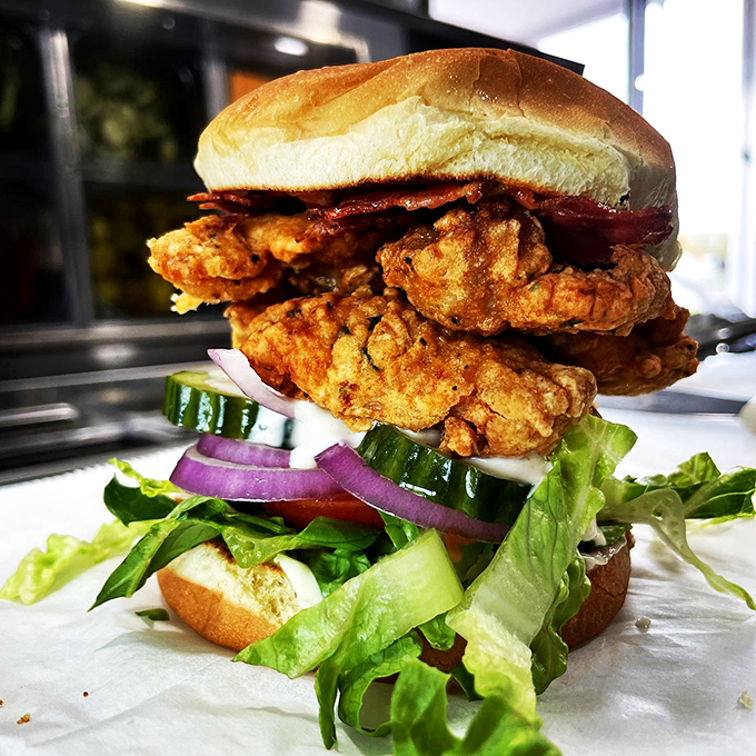 Architectural masterpiece or lunch? This towering fried chicken burger makes a compelling case for being both.