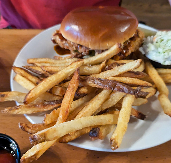 This burger arrives looking like it graduated summa cum laude from hamburger university.