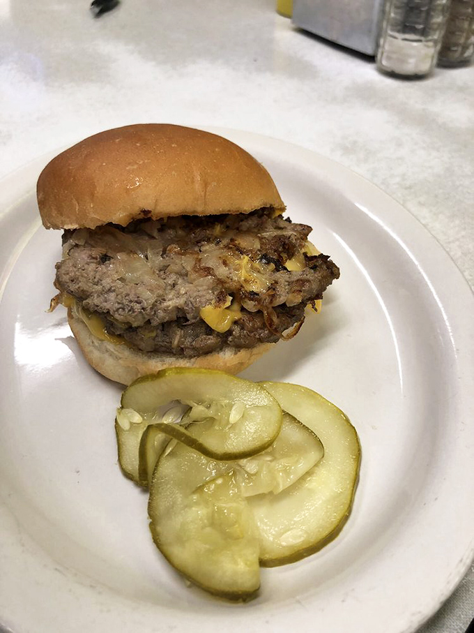 This isn't just a burger; it's a masterclass in simplicity. Those caramelized onions melted right into the patty are the stuff of dreams.
