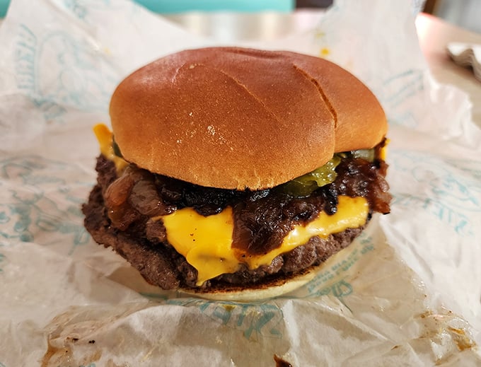 Behold burger perfection: charred edges, melty cheese, and a bun that knows its supporting role. No filter needed for this kind of beauty.
