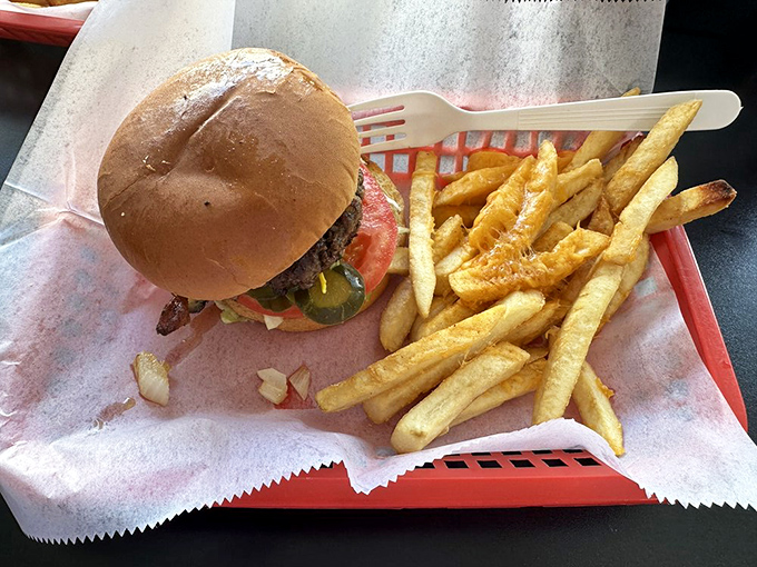 This isn't just a burger, it's edible architecture &ndash; a hand-formed patty on a toasted bun with fries that deserve their own fan club.