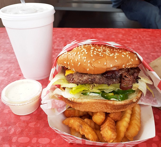 Behold the architecture of satisfaction&mdash;a perfectly stacked burger, golden crinkle fries, and a shake that requires serious straw commitment.