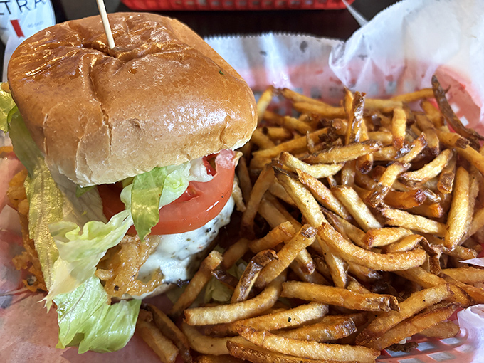 A burger that doesn't need Instagram filters to look good, paired with fries that achieve that mythical balance of crispy exterior and fluffy interior.