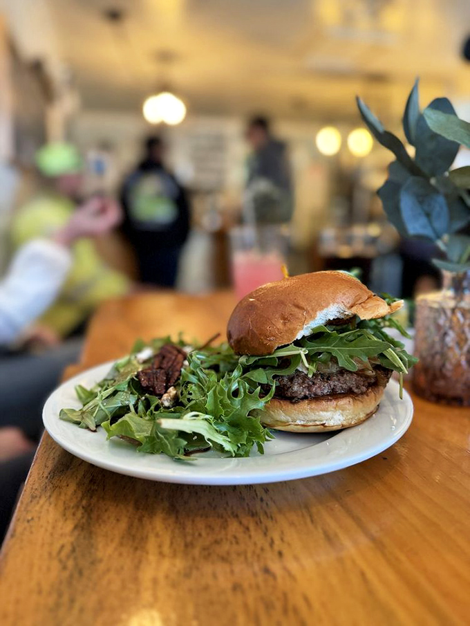 This isn't just a burger; it's a masterclass in balance. The peppery arugula cutting through richness, all nestled in a bun that knows its supporting role.