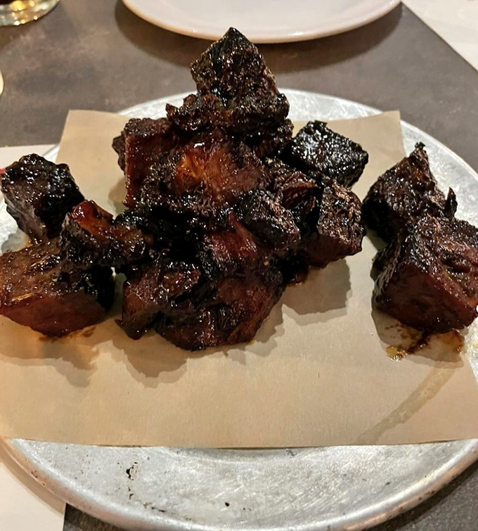 Behold the burnt ends that launched a thousand food comas - charred cubes of beef brisket perfection awaiting your devotion.