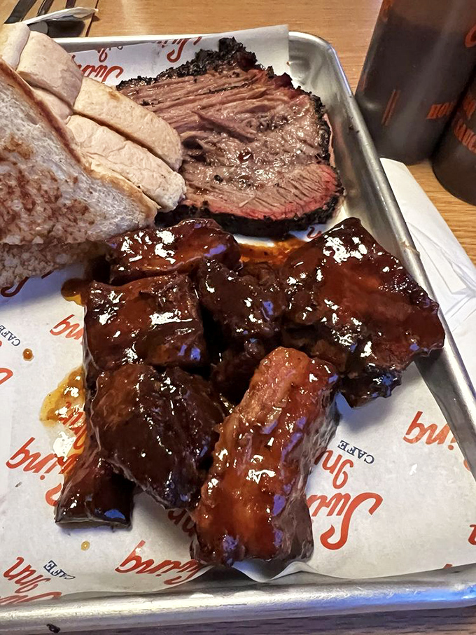 That magnificent beef rib stands tall like a delicious dinosaur bone, coleslaw playing the supporting role beautifully.