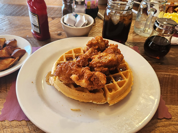 Chicken and waffles: where Southern charm meets Midwestern hospitality. That crispy coating shatters like New Year's resolutions in February.