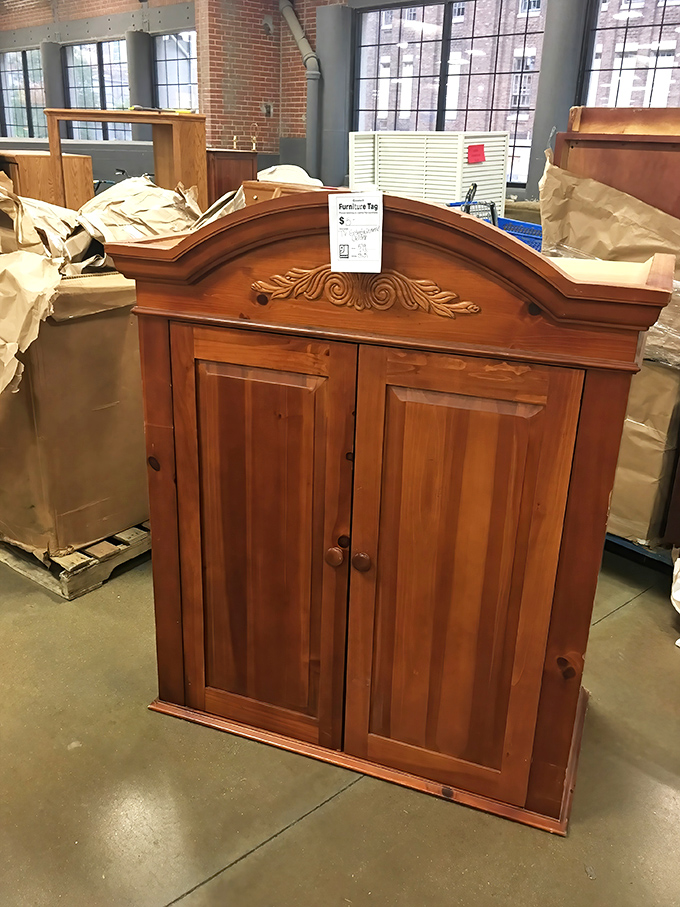 This isn't just furniture&mdash;it's someone's future heirloom. A solid wood cabinet with ornate detailing that would cost a fortune new sits patiently for its next home.