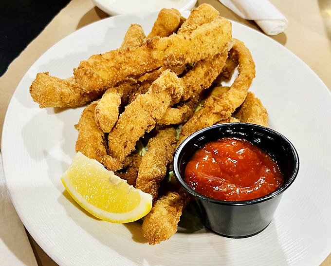These golden calamari fingers aren't just fried &ndash; they're transformed into crispy treasures that would make even coastal snobs nod in approval.