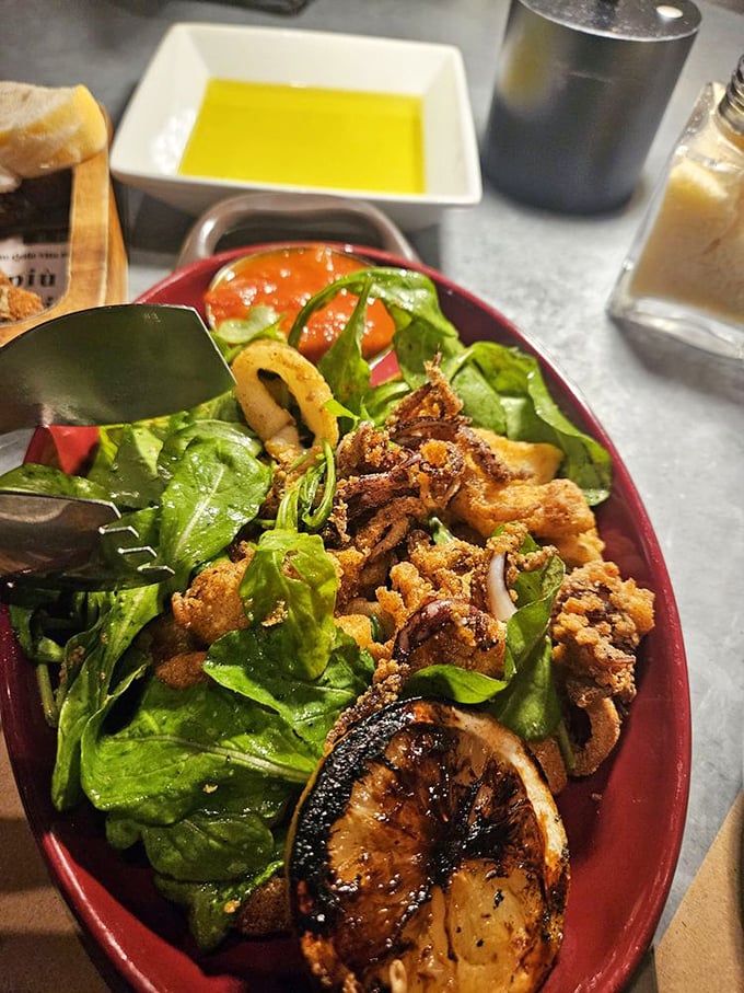 The legendary calamari arrives nestled on arugula with grilled lemon. This isn't just fried squid; it's the reason Ohioans drive across counties and cancel plans.