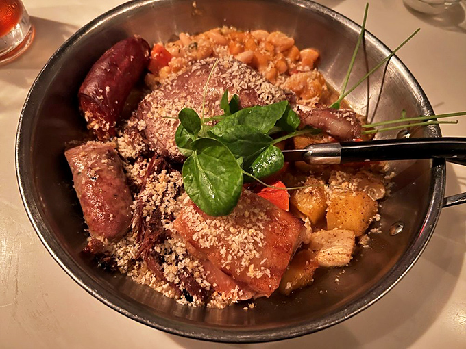 This isn't just dinner&mdash;it's edible architecture. Layers of sausage, beans, and meat create a cassoulet that would make a Frenchman weep with joy.