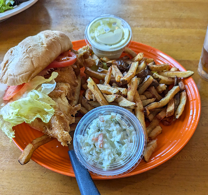 This catfish sandwich isn't just food&mdash;it's an event. Crispy fish, fresh toppings, and those hand-cut fries could make a pescatarian weep with joy.