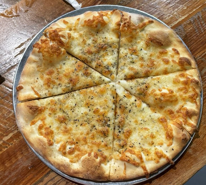 This white pizza isn't just a meal&mdash;it's a religious experience with perfectly blistered crust and herbs that mean business. 