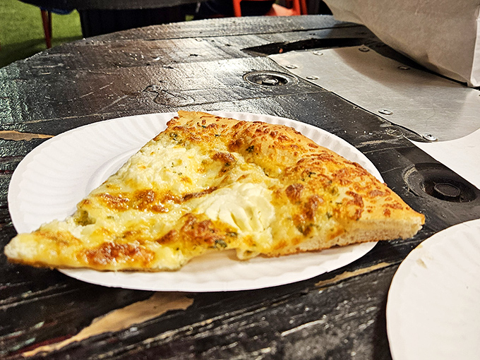 Behold the cheese pizza in its purest form—bronzed, bubbling perfection that proves simplicity isn't just a virtue, it's an art form.
